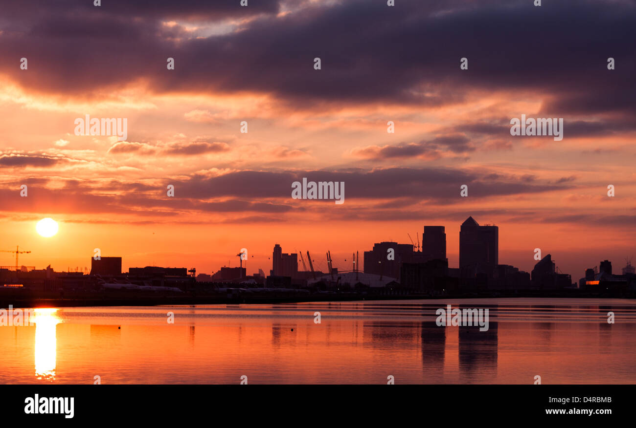 Canary Wharf and O2 Arena Sunset with reflection in the water in a ...