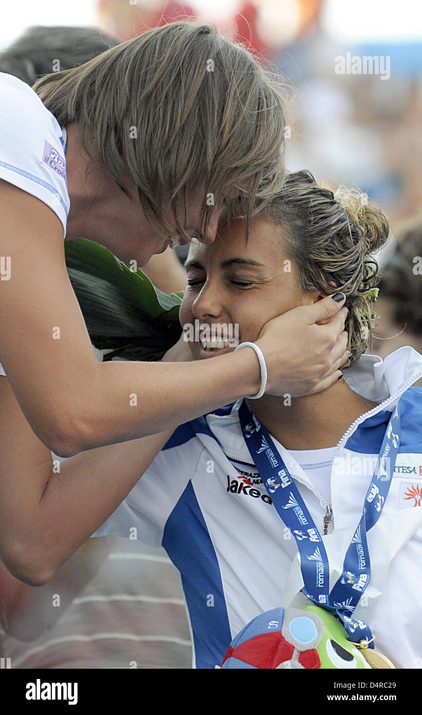 Italian swimmer Alessia Filippi (R) celebrates her gold medal after her ...
