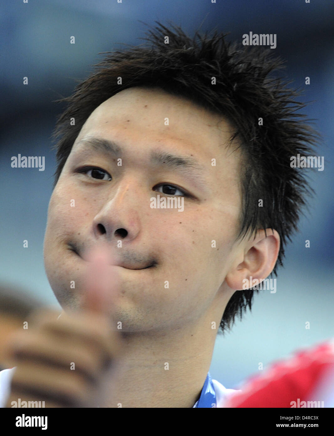 Chinese swimmer Lin Zhang celebrates on the podium for the men?s 800m ...