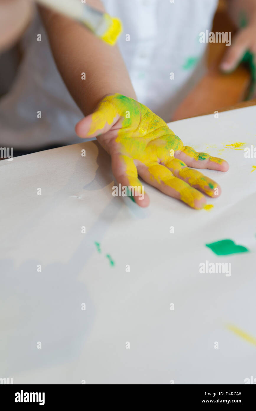 Kids hand covered in paint hi-res stock photography and images - Alamy