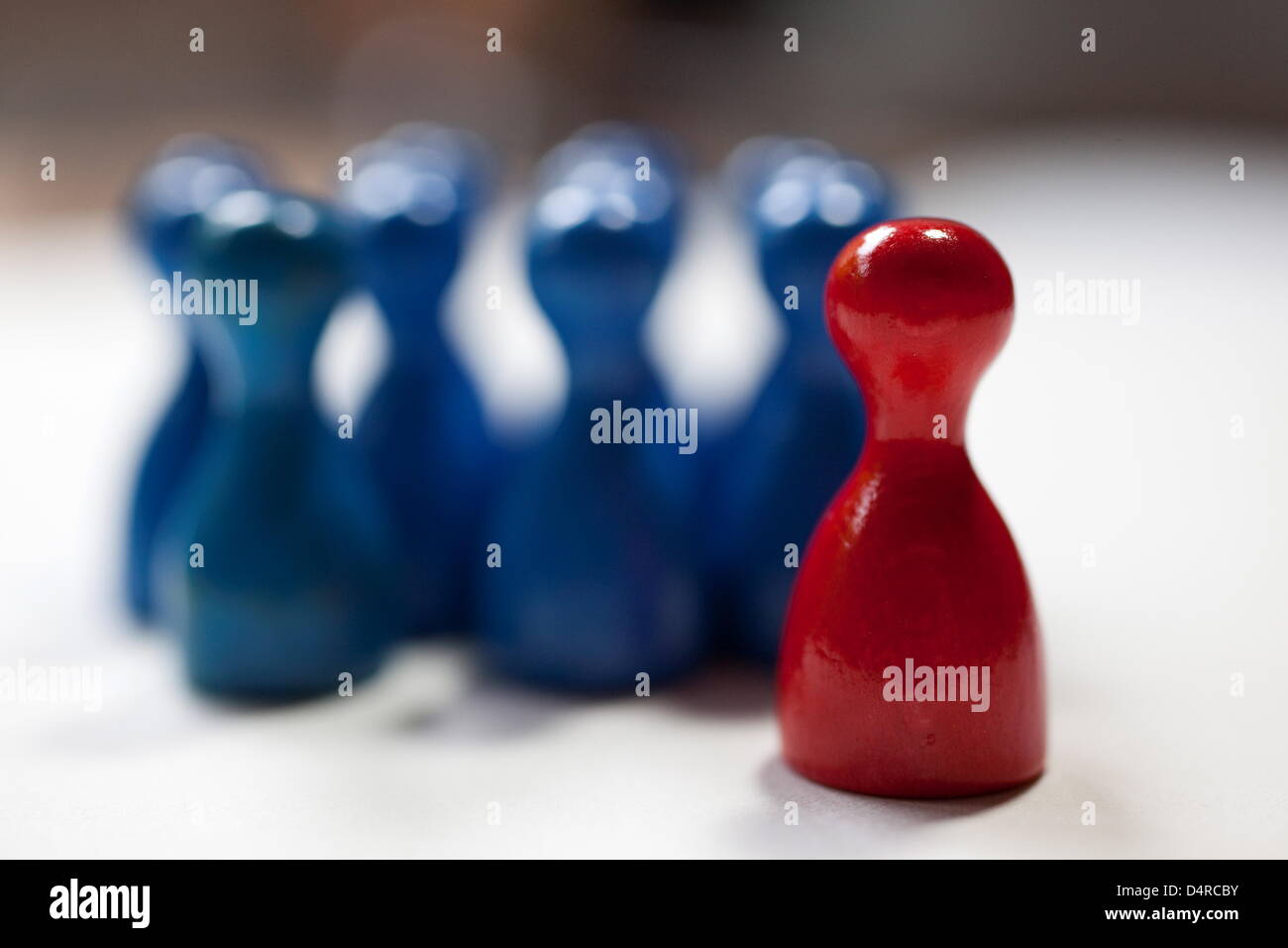 ILLUSTRATION - A red board game figure depicted clearly in front of a ...