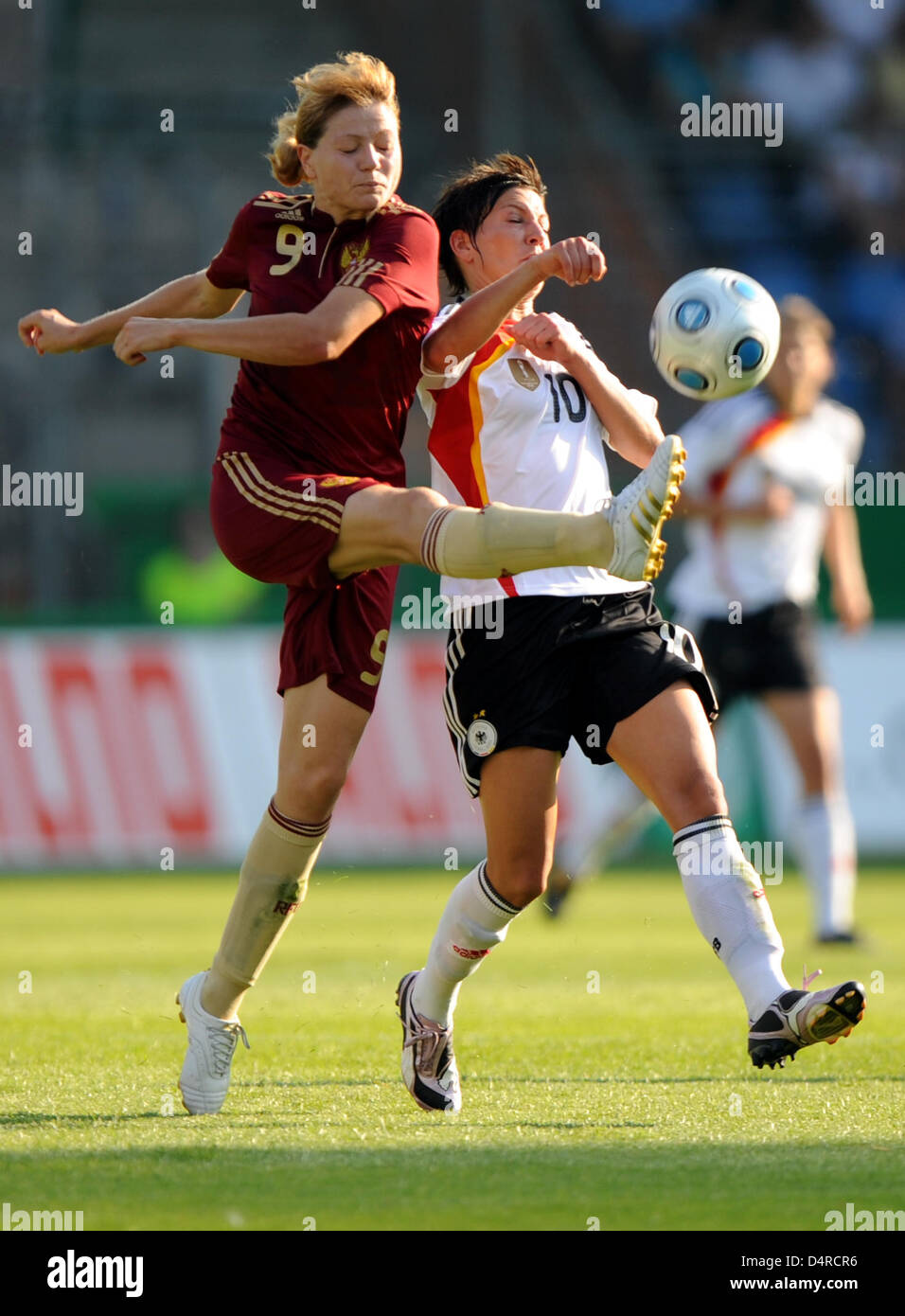 German Linda Bresonik (R) fights for the ball with Russian Elena Fomina ...