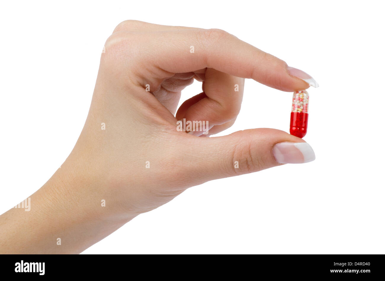 hand holds pill isolated on white Stock Photo - Alamy