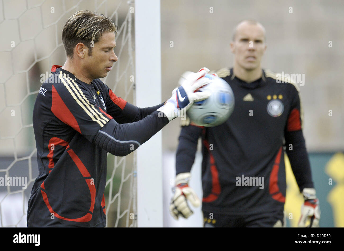Germany?s goalkeepers Tim Wiese (L) and Robert Enke warm up during a ...