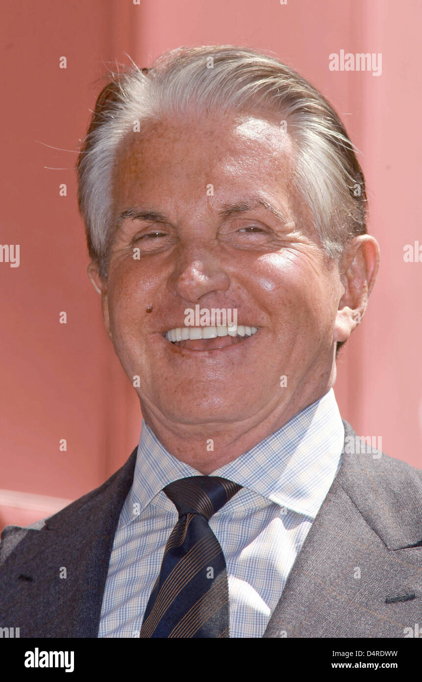 US actor George Hamilton poses during the ceremony for his new star on ...