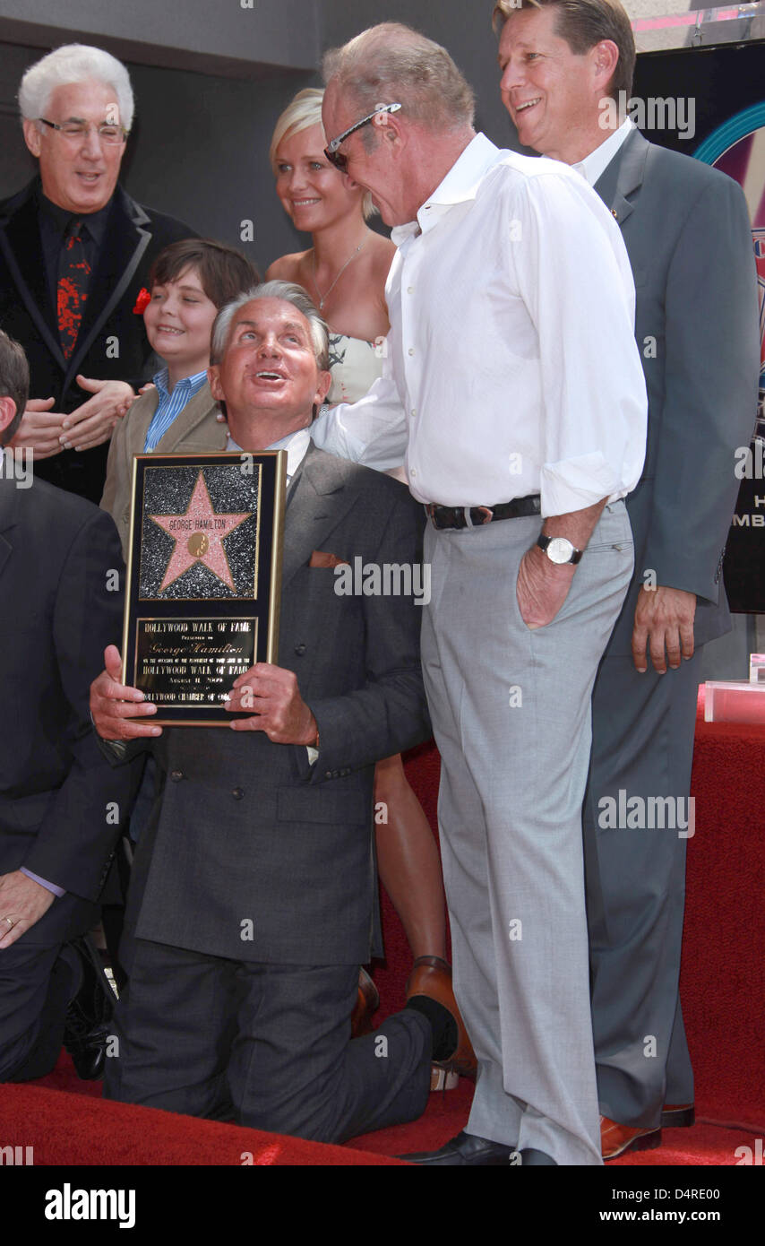 US actor George Hamilton (C), his son George ?GT? Hamilton (2-L), his ...