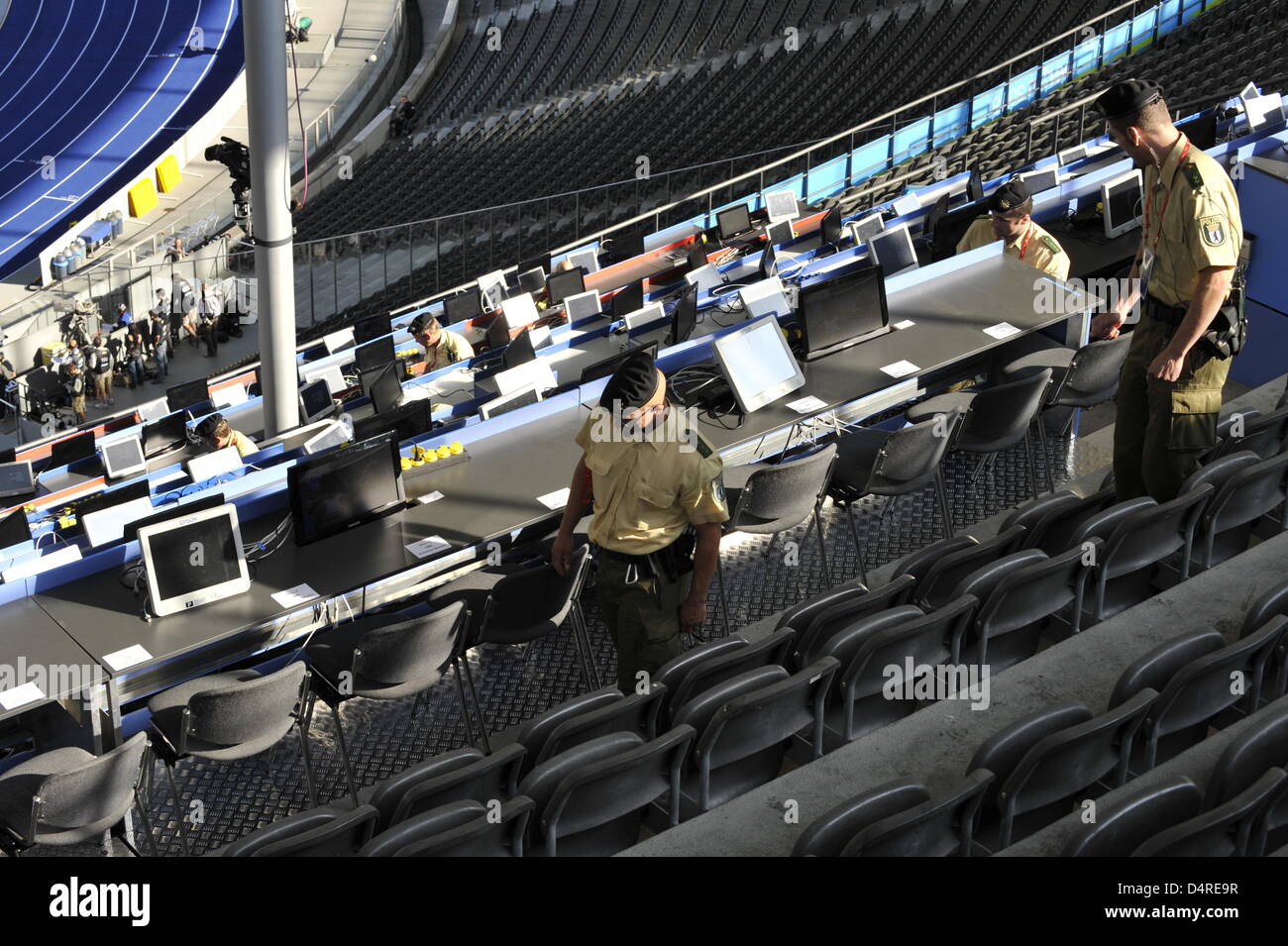 Police officers check the stands in the Olympic stadium prior to start ...