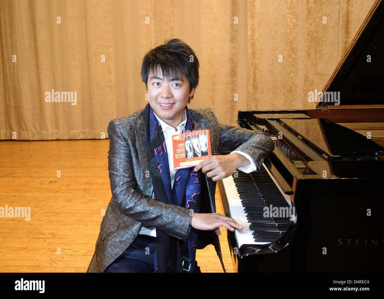 Chinese pianist Lang Lang poses with his CD ahead of Lang Lang ...