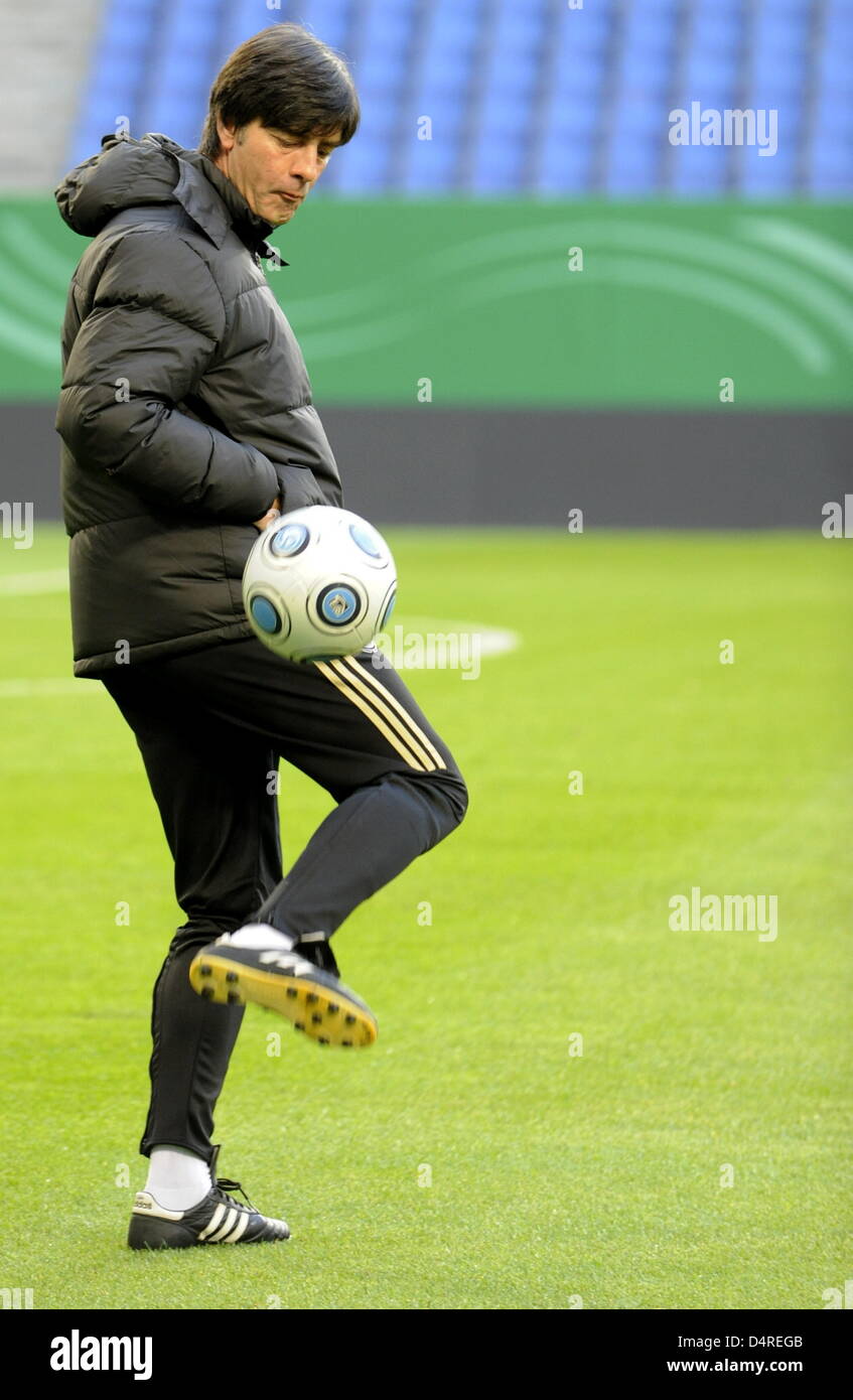 Joachim Loew, head coach of the German national soccer team, juggles a ...