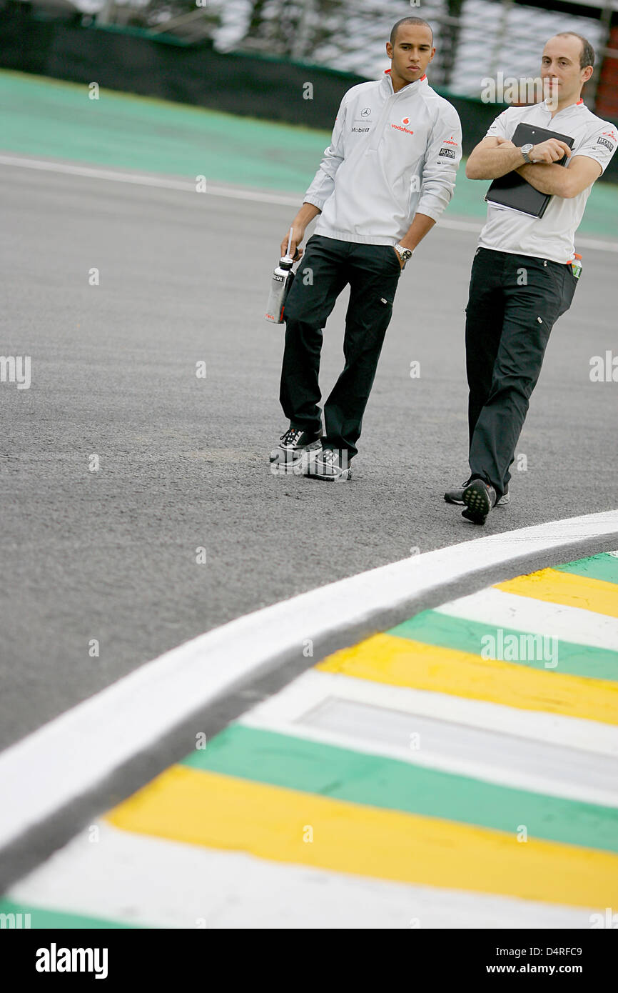 British Formula One driver Lewis Hamilton of McLaren Mercedes (L) and ...