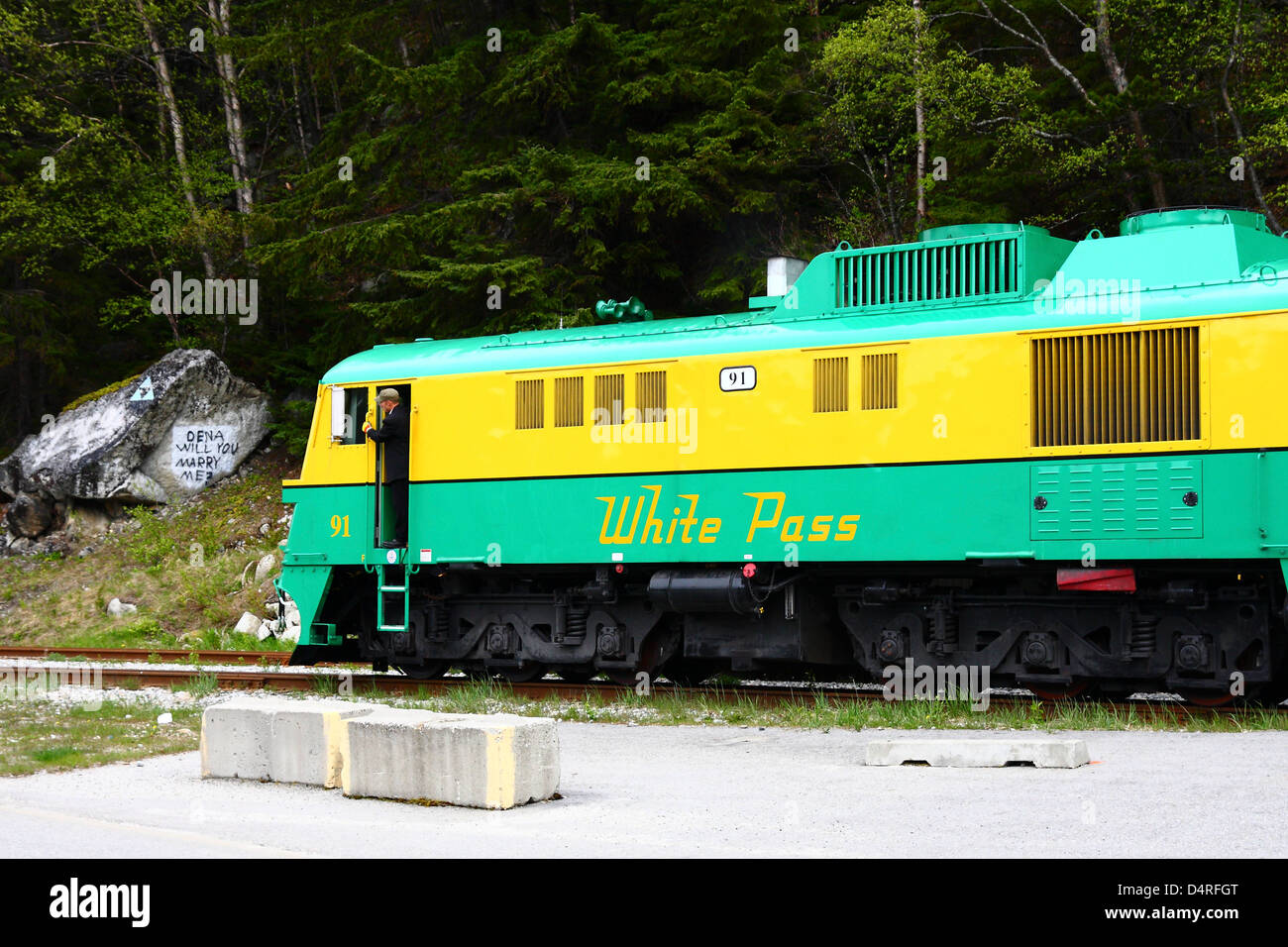 White Pass Railroad with Conductor looking out the door Stock Photo - Alamy