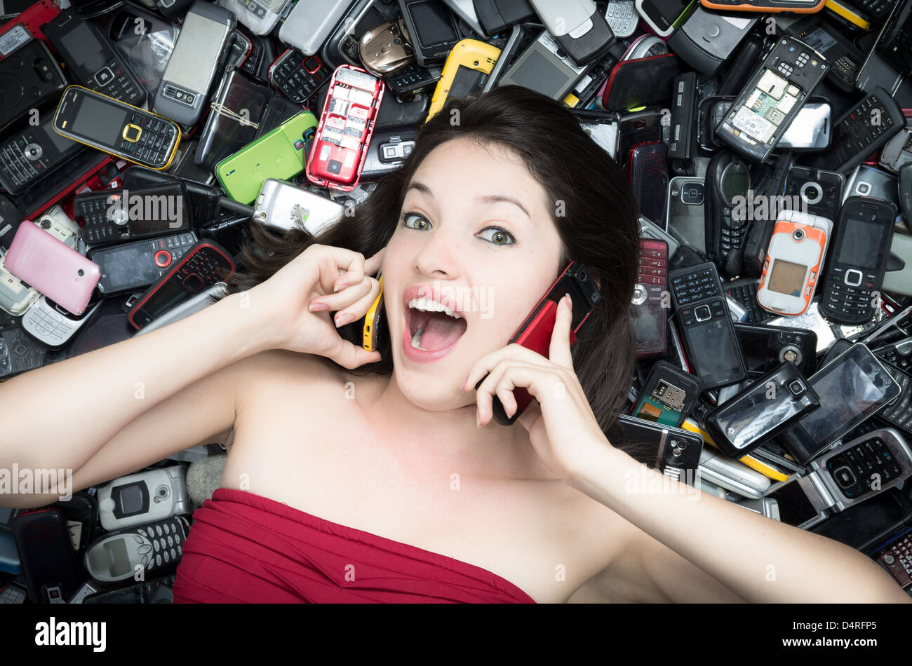 Woman on top of a Pile of mobile cell phones Stock Photo - Alamy Woman on top of a Pile of mobile cell phones Stock Photo - Alamy