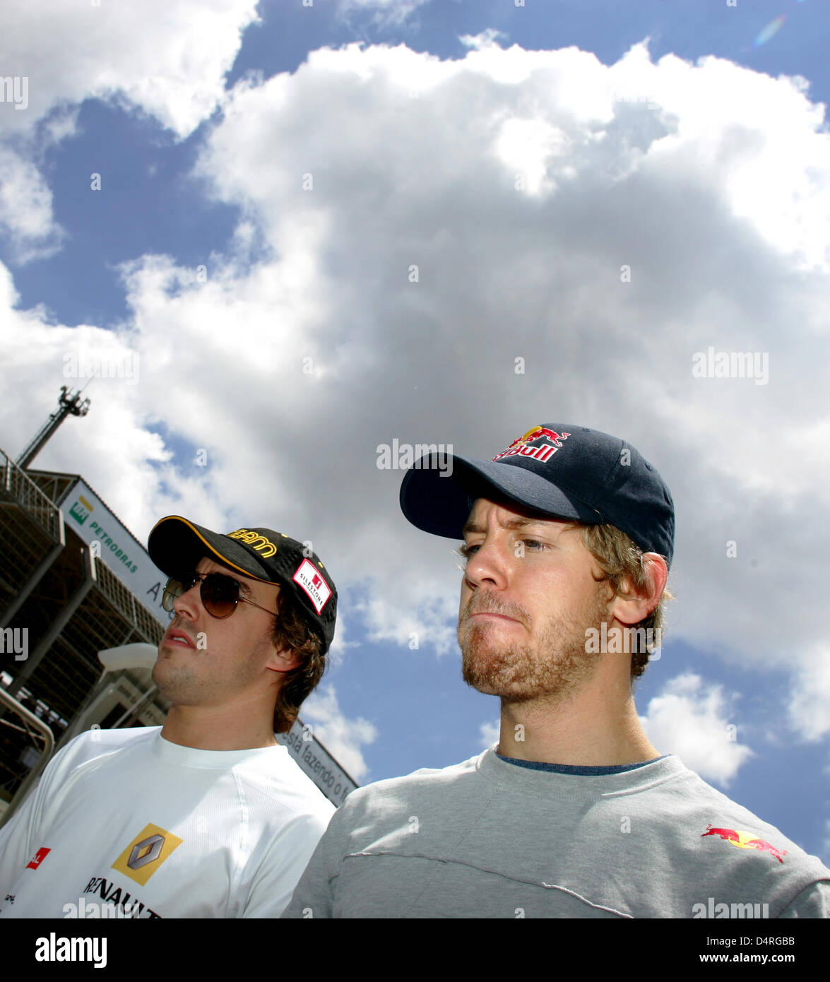 German Formula One driver Sebastian Vettel (r) of Red Bull Racing and ...