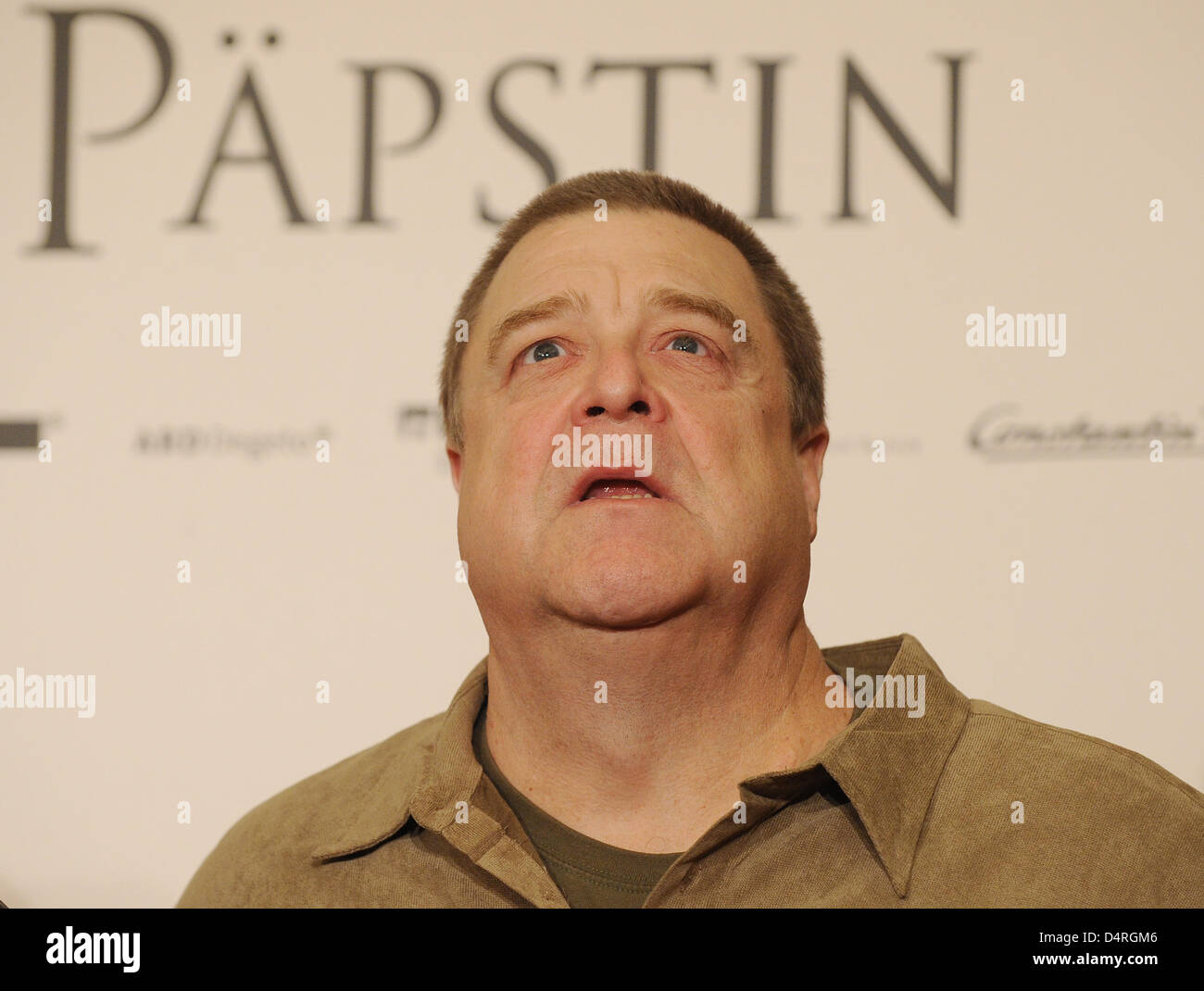 US actor John Goodman stands in front of a film poster during a photo ...