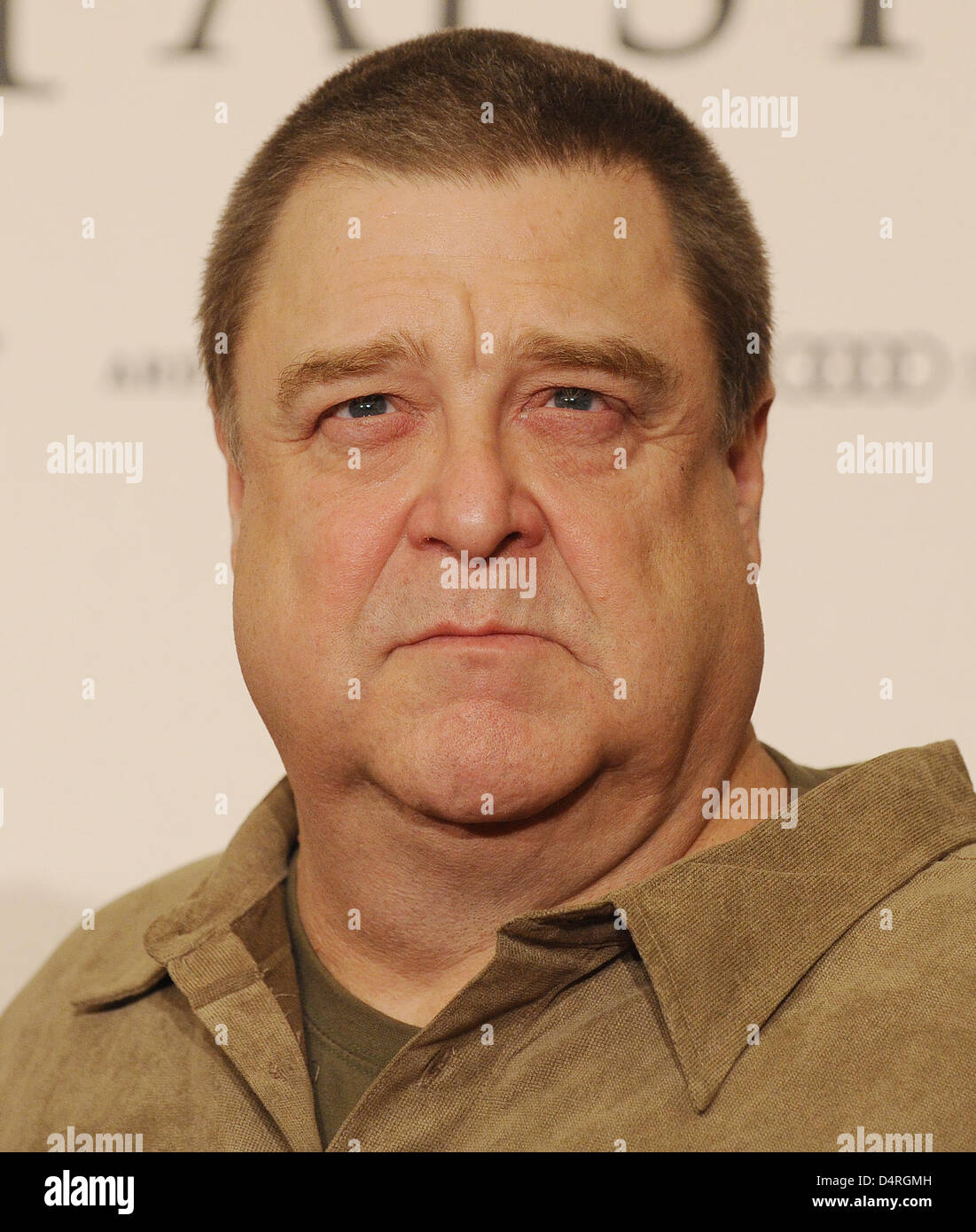 US actor John Goodman stands in front of a film poster during a photo ...