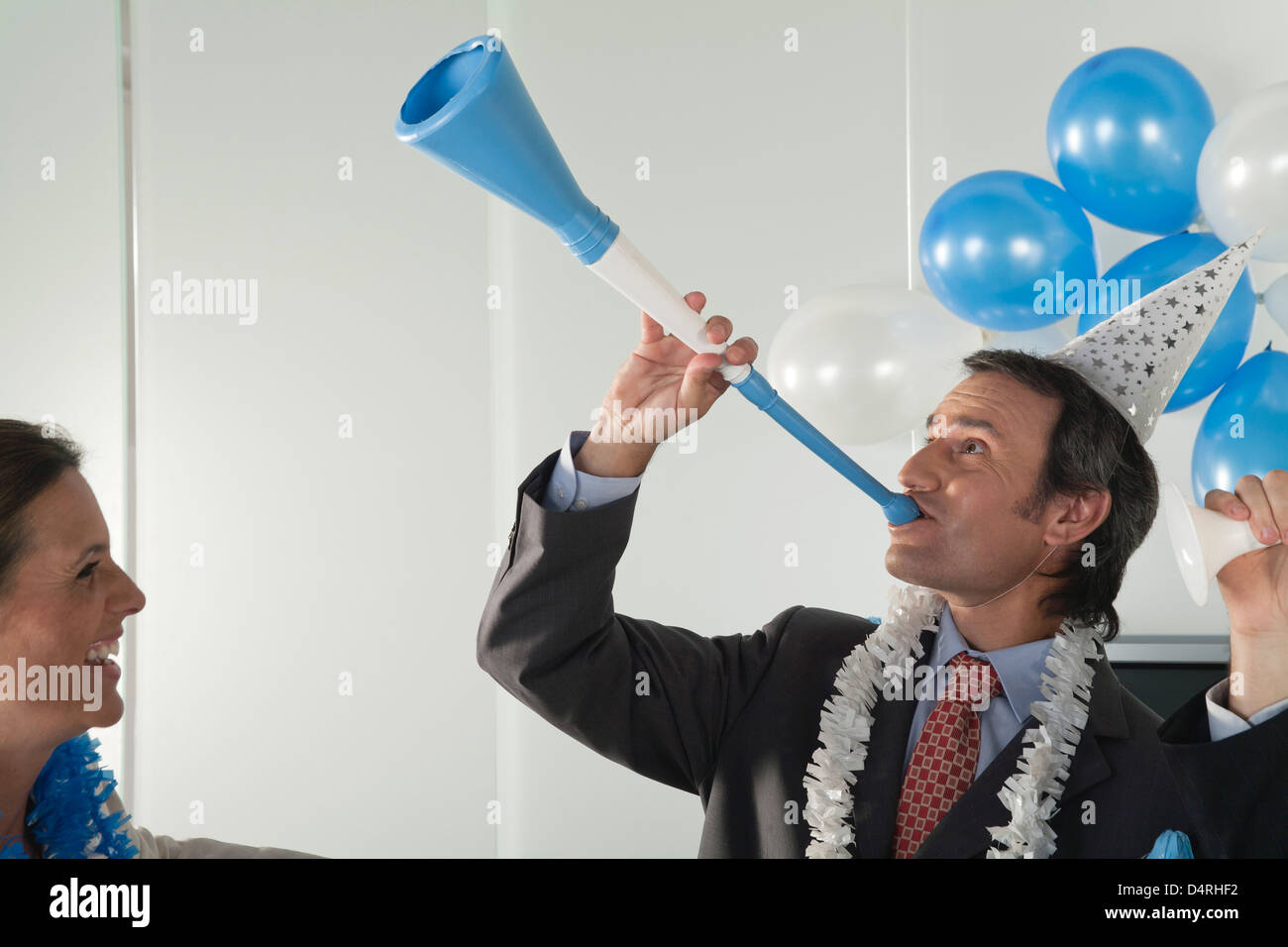 Mature man party blower hi-res stock photography and images - Alamy