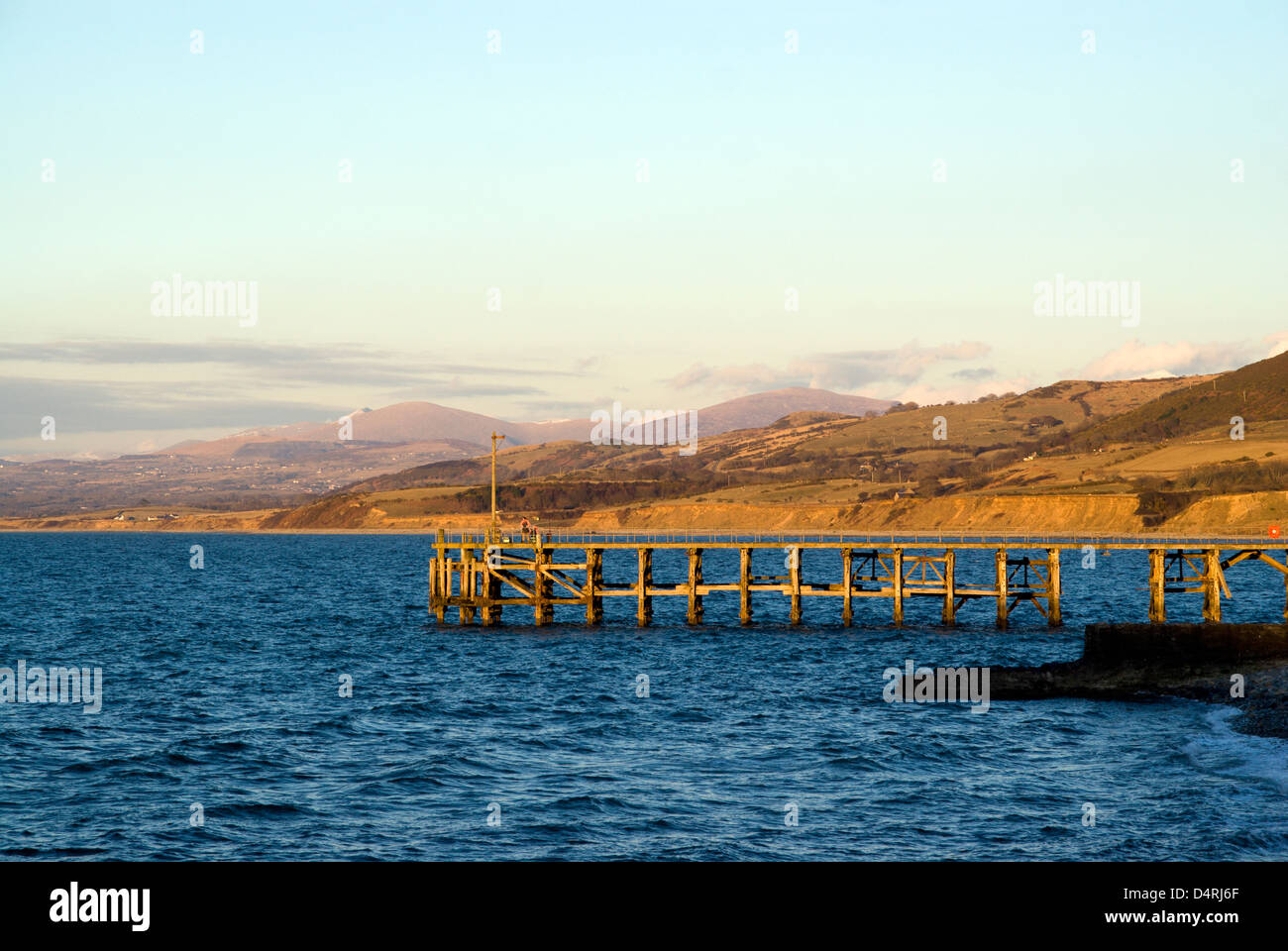 jetty and view looking across sea to snowdon range from trefor on the ...