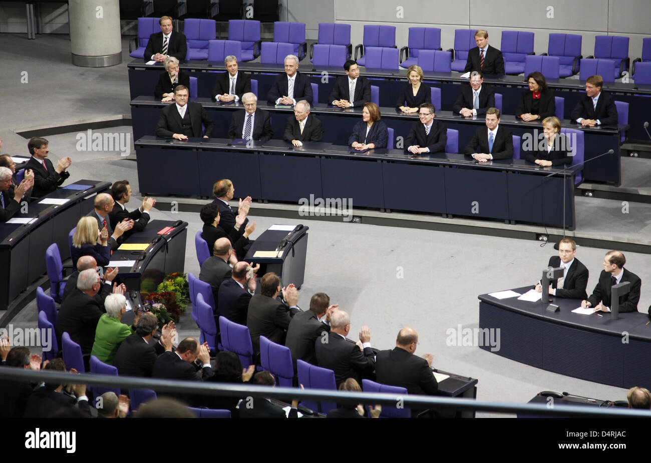 The new German government is pictured at the Bundestag in Berlin ...