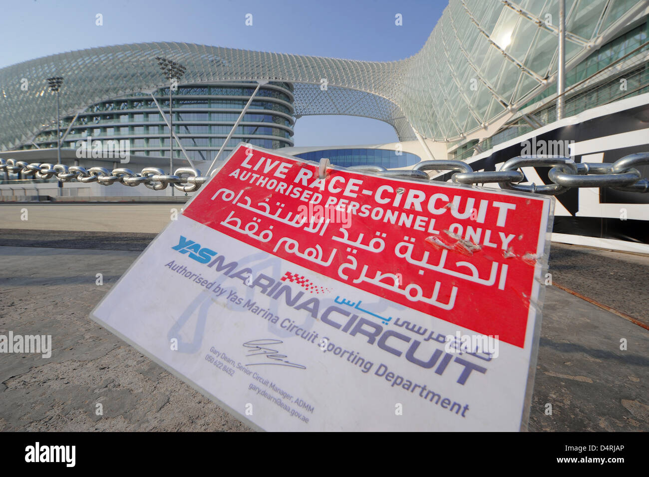A security sign hangs at the entry from the racetrack near the Yas ...