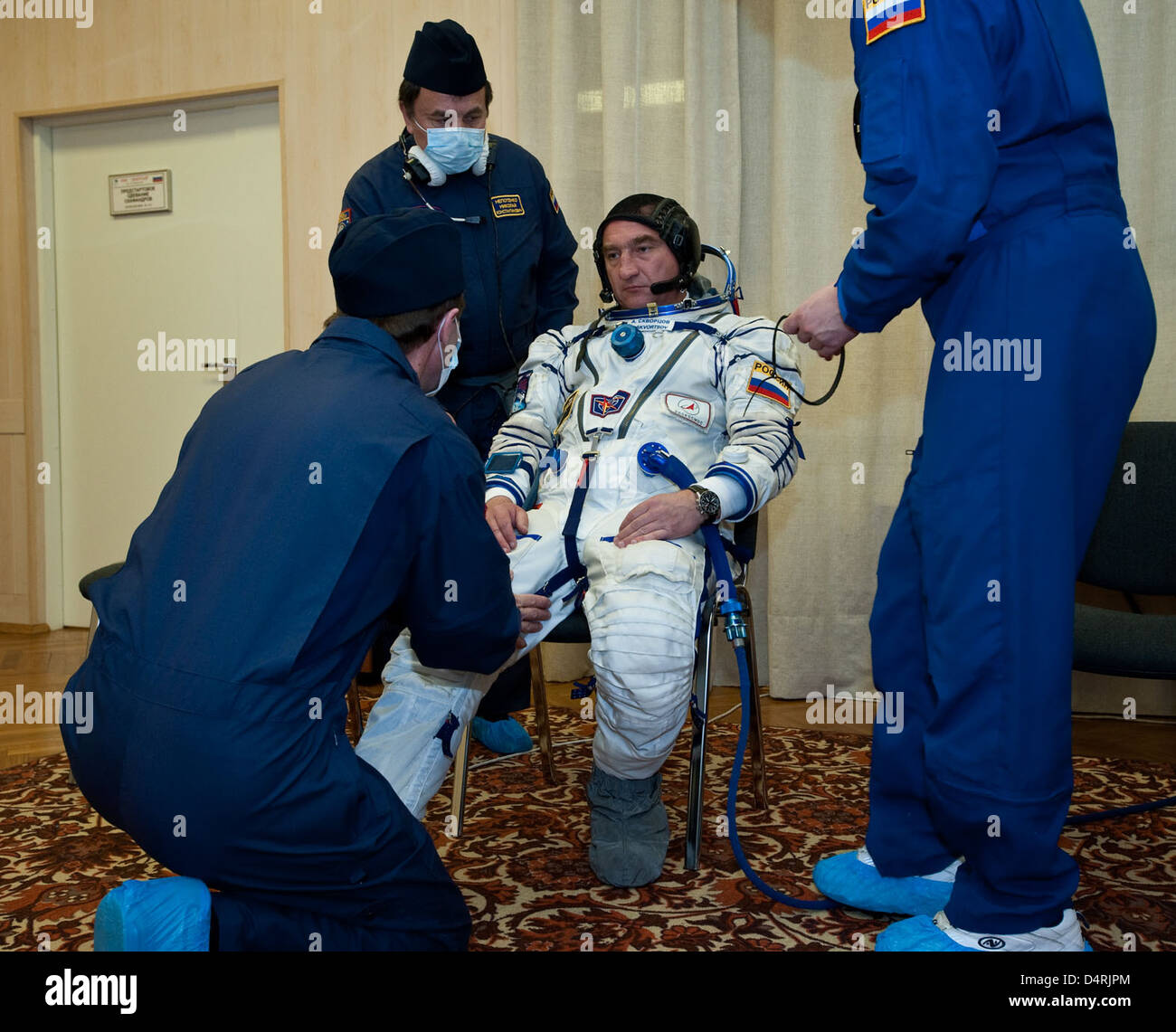 Expedition 23 crew, including astronauts Alexander Skvortsov and Mikhail Kornienko, prepares for ...