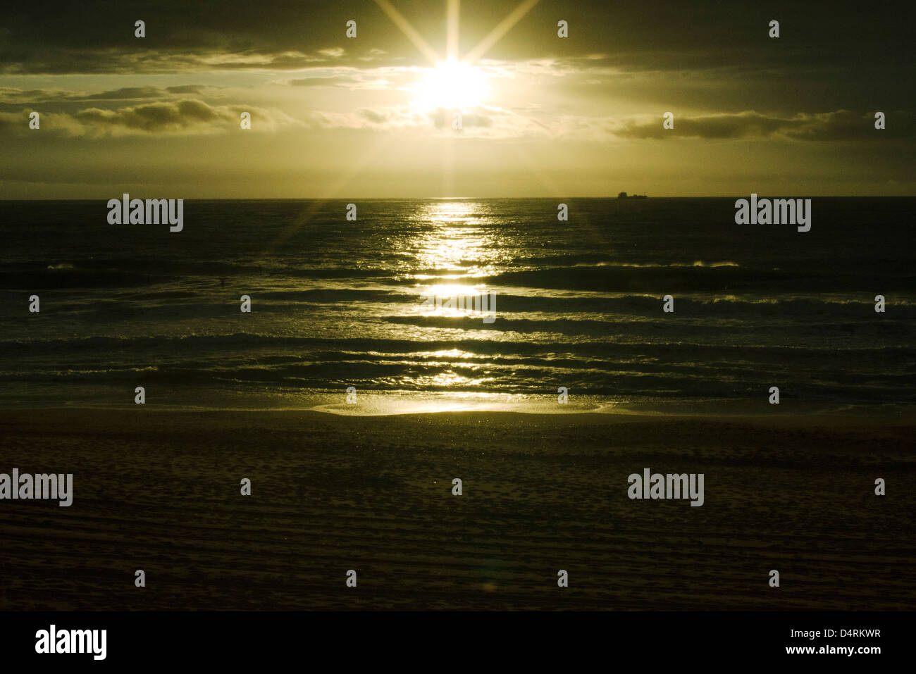 Sunset over the Atlantic Ocean, ship on the horizon, Ondres France ...