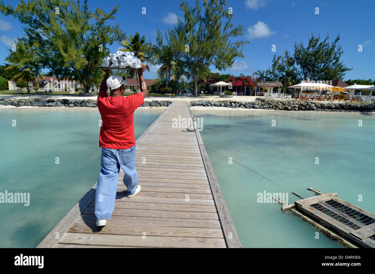 Carrying lobster for grilling at the Anegada Reef Hotel, Anegada ...