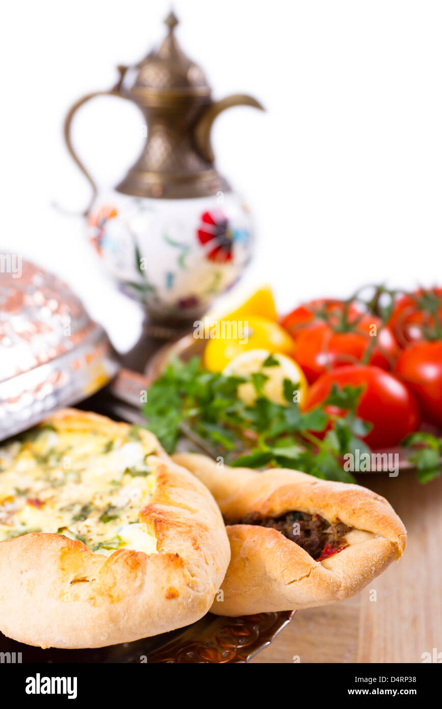 Made with cheese and seasoned ground beef Turkish pide garnished with ...