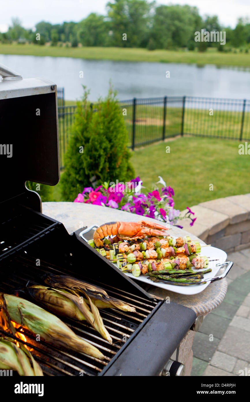 Mediterranean fish shish kebabs and lobster next to the BBQ right after ...