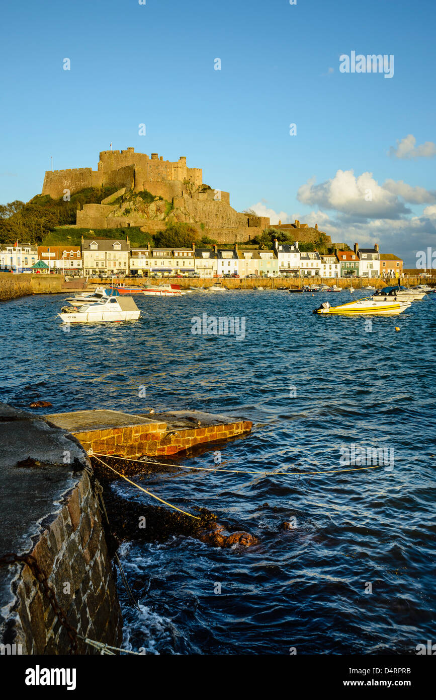 Mont Orgueil Castle rises above the harbour of Gorey on Jersey Stock ...