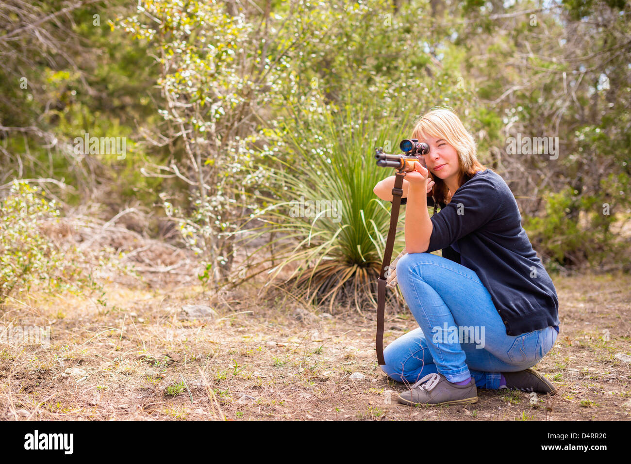 Young woman shooting a hunting rifle firearm, Female 19 Caucasian ...