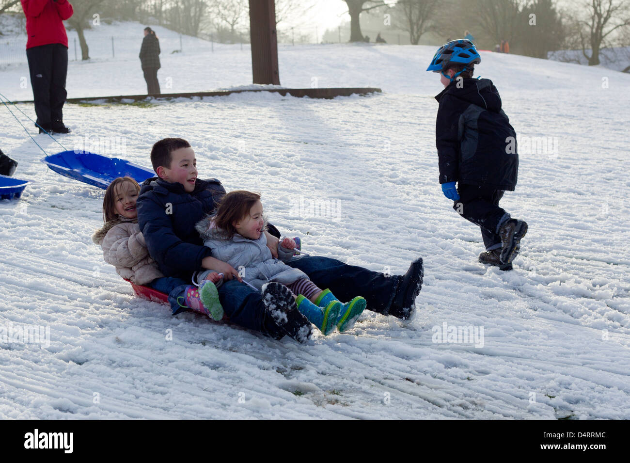 Children sledging in the snow on the Glebe Stock Photo - Alamy
