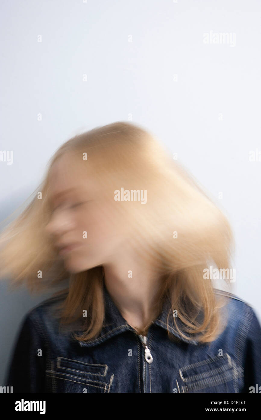 Young woman tossing her hair Stock Photo - Alamy