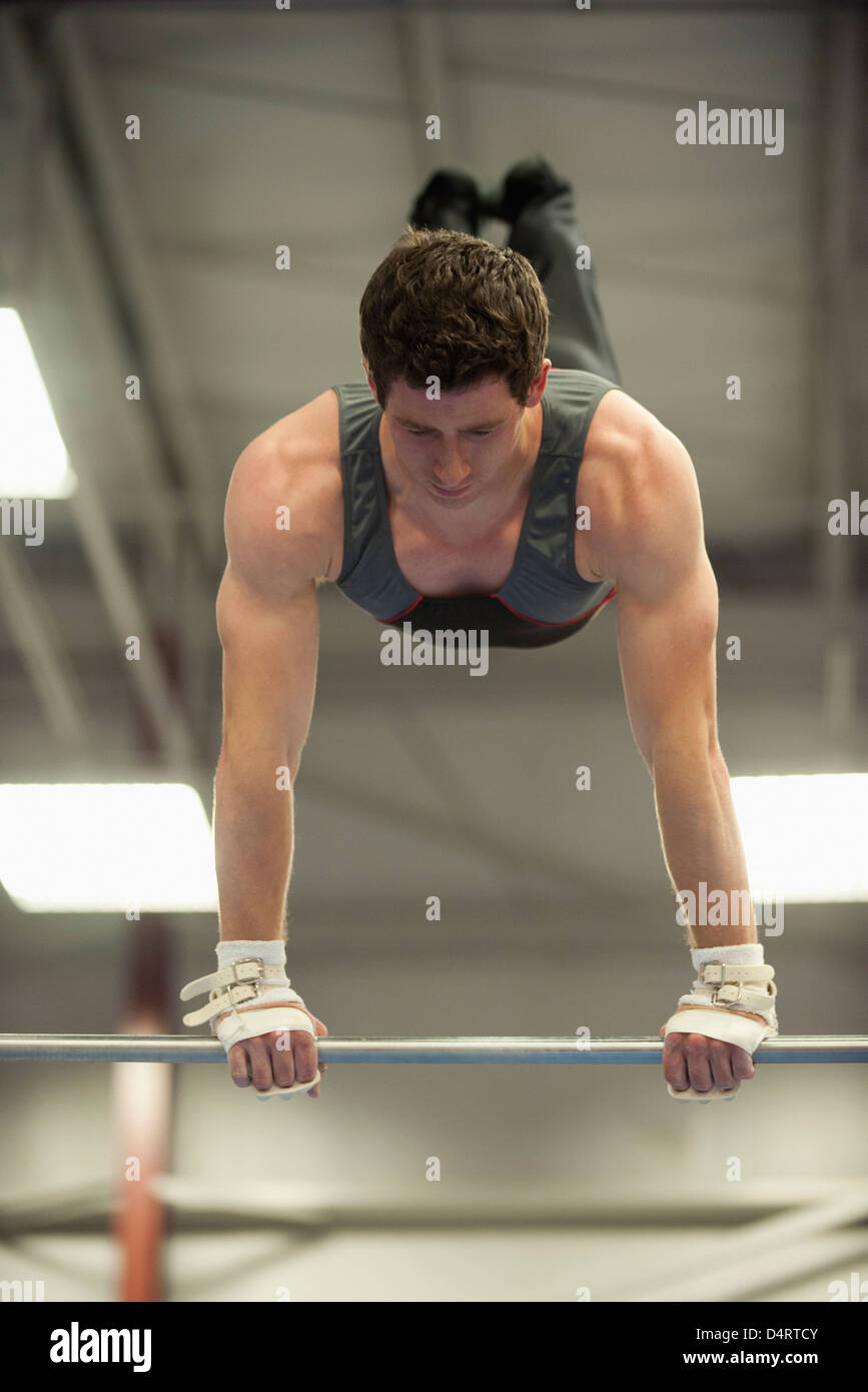 Male gymnast on horizontal bar Stock Photo - Alamy