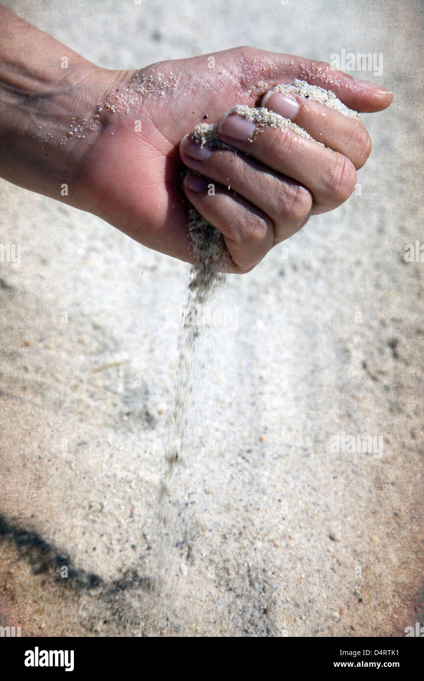 Hands With Sands of Time Stock Photo - Alamy