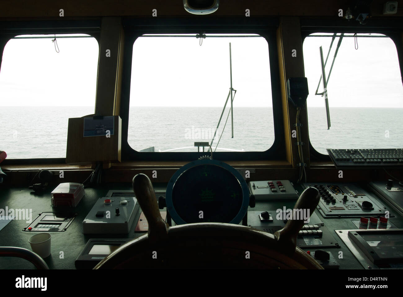 Cockpit of a boat, seen on the horizon Stock Photo - Alamy