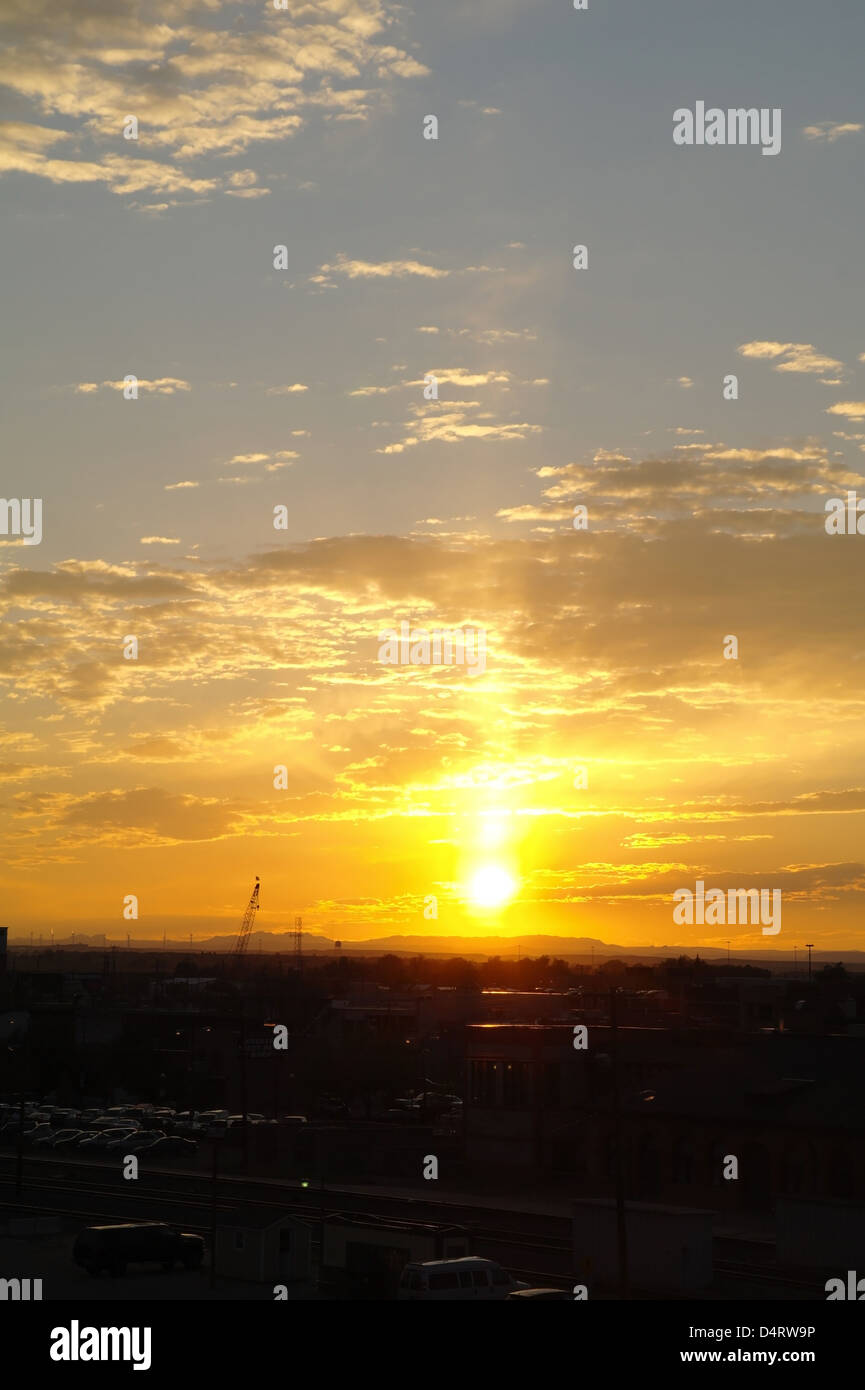 Portrait yellow sun setting Western hills, cumulus clouds sky, from ...