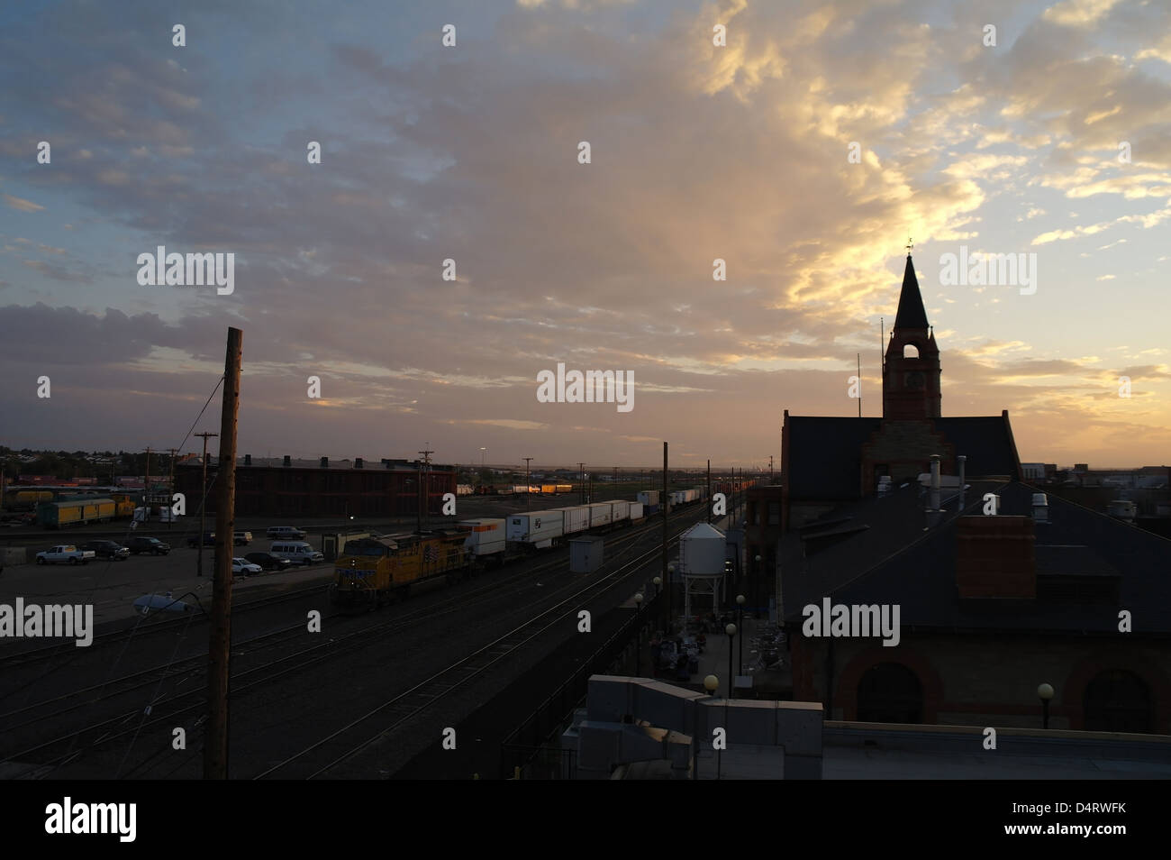 Sunset view engine pulling a long freight train past Union Pacific ...