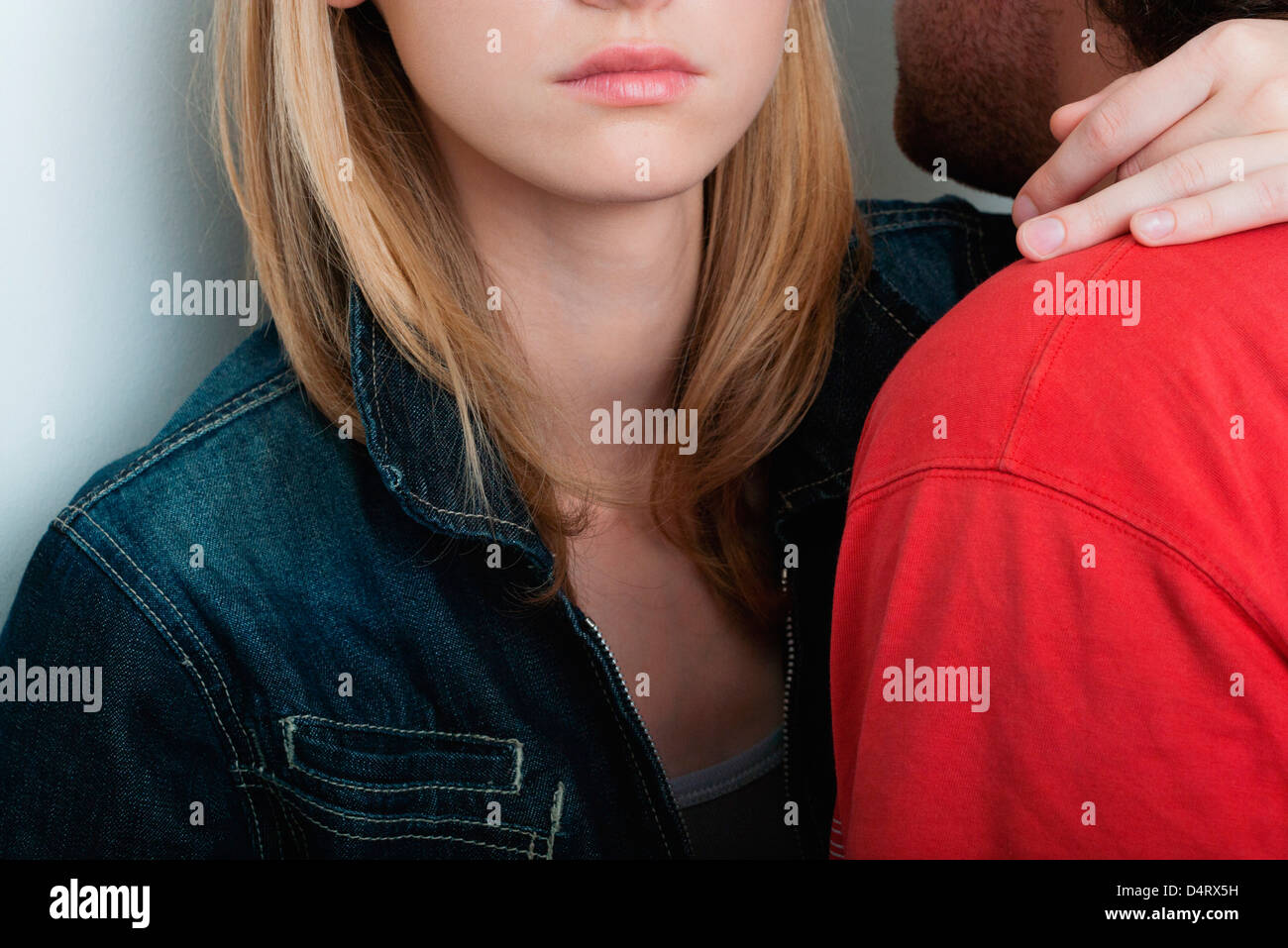Young couple embracing, cropped Stock Photo - Alamy