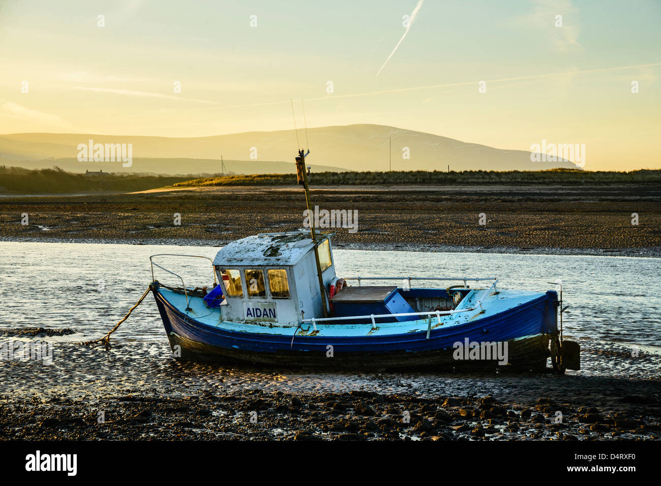 Boat by the estuary of the river Esk at Ravenglass in the Lake District ...