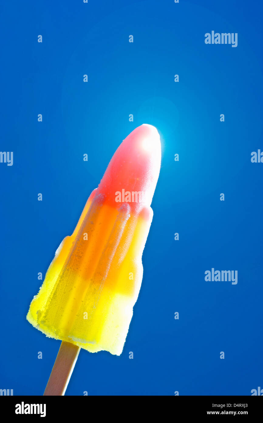 Rocket Shaped Ice Lolly against Blue Background Stock Photo - Alamy
