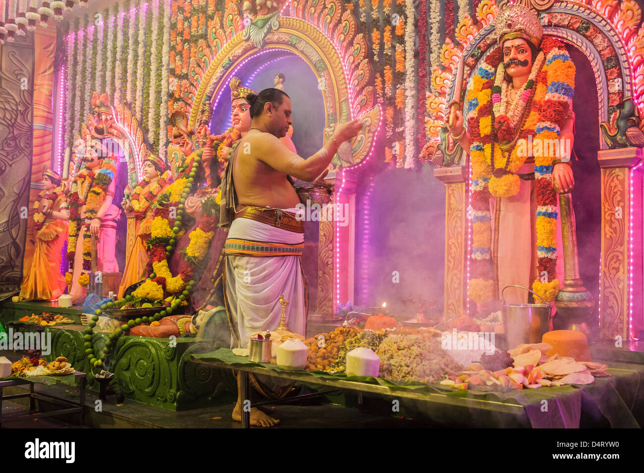 Priest performing a hinduist ceremony, Singapore, Asia Stock Photo - Alamy