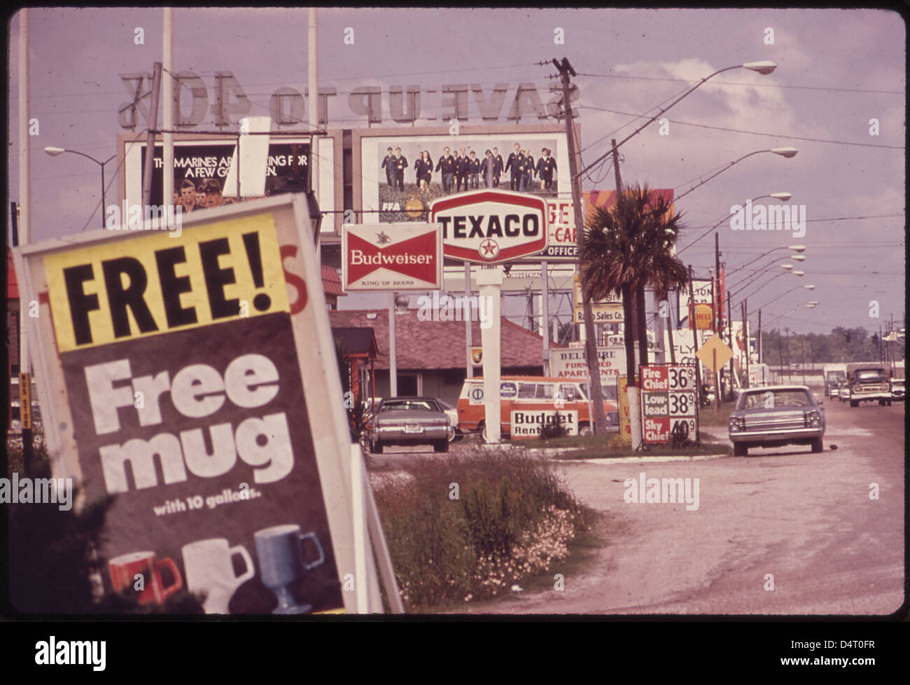 A photograph from June 1972 showing a cluttered roadside filled with ...
