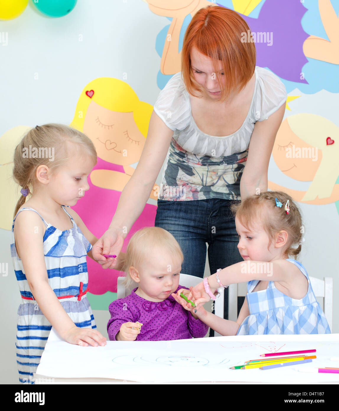 Children drawing with pencils in classroom Stock Photo - Alamy