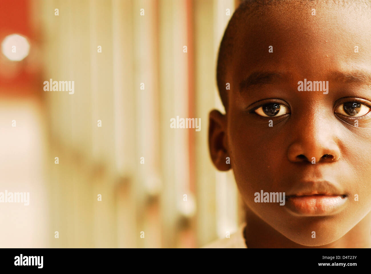 Africa, Angola, Luanda, close-up portrait of a bald African boy in ...