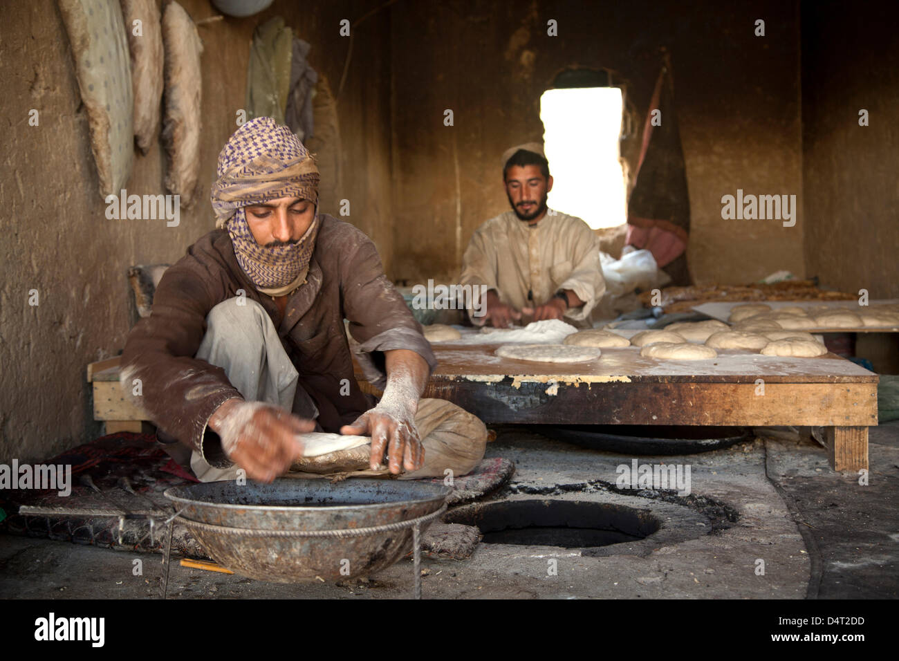 Bakers prepare traditional Afghan flat bread in a village March 17 ...