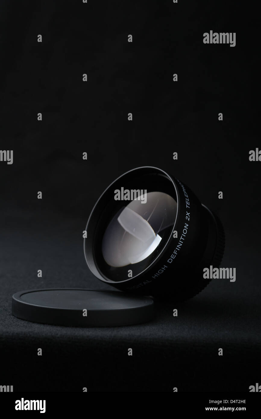 Camera lens close up on black background Stock Photo - Alamy