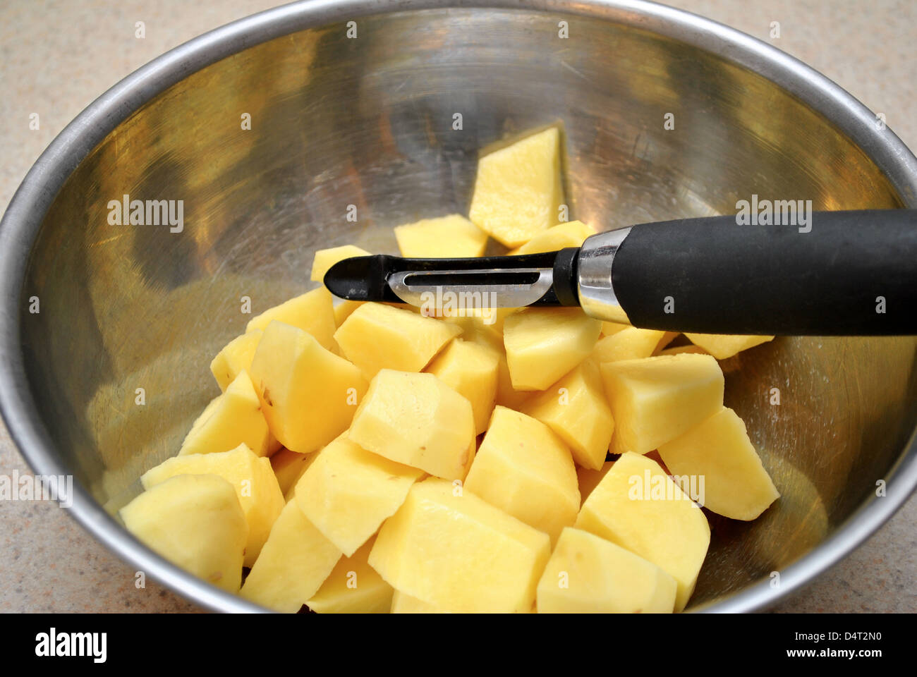 Raw peeled potatoes hi-res stock photography and images - Alamy