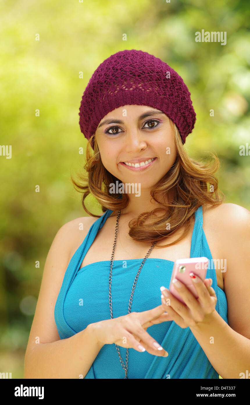 A portrait of a smiling beautiful woman texting Stock Photo - Alamy