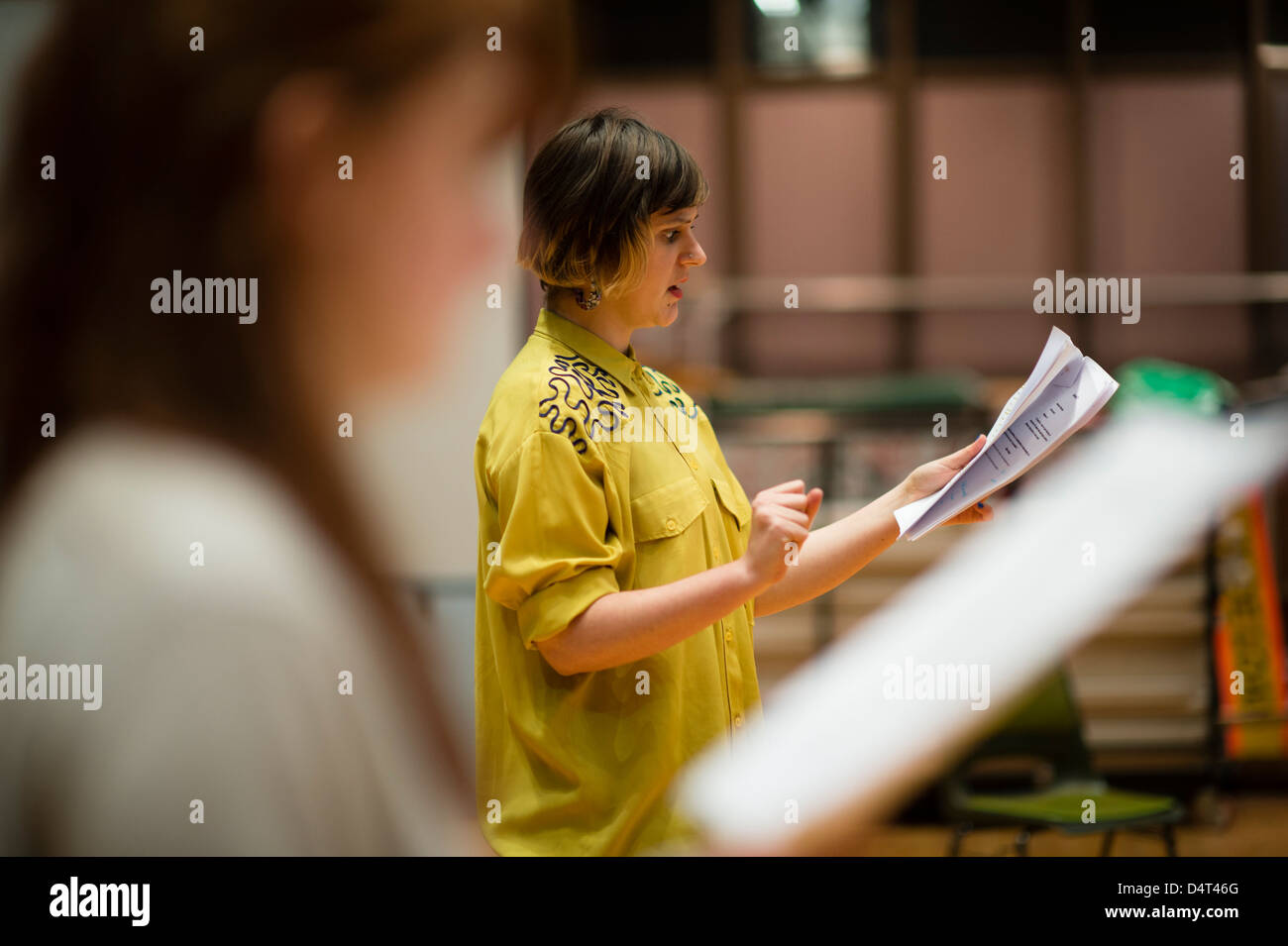Women actors holding their scripts rehearing a new play drama in a ...
