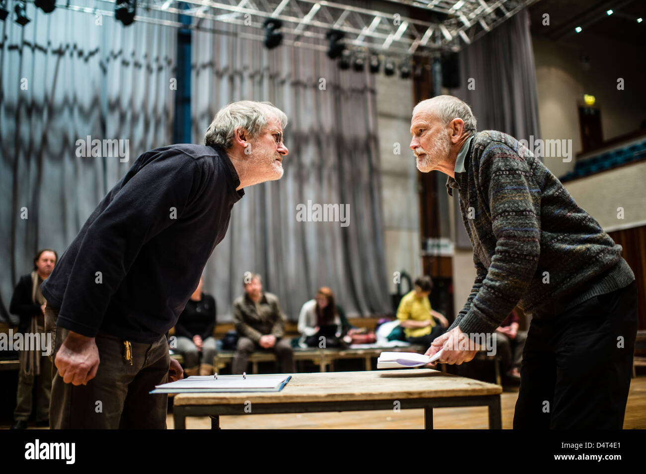 Actors holding their scripts rehearing a new play drama in a theatre ...